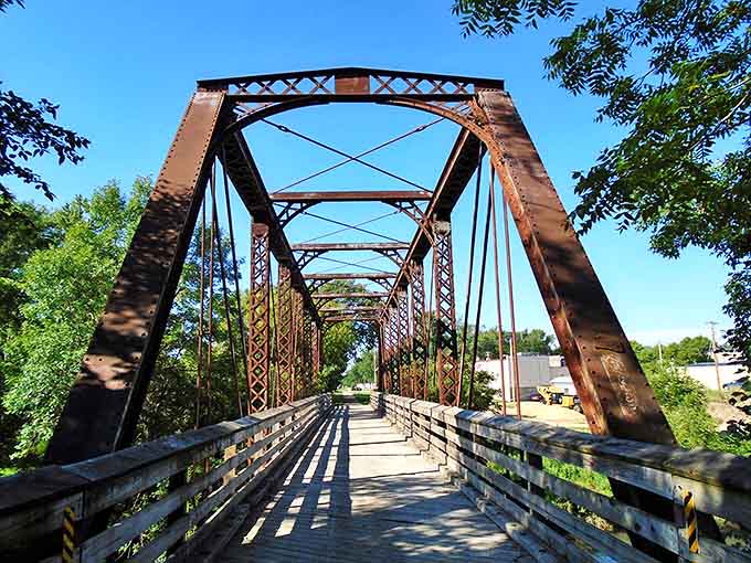 This iron sentinel has stood watch for generations, its rusty frame supporting countless crossings over Wisconsin waters.