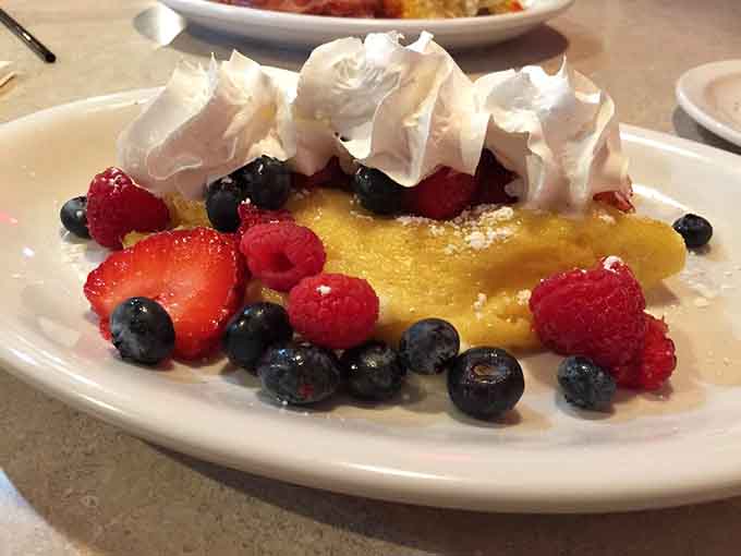 Delicate crepes filled with three types of berries and topped with whipped cream make dessert for breakfast feel completely justified.