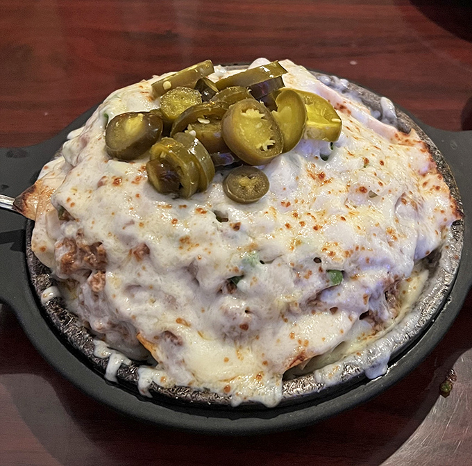 Melted cheese blankets this hearty dish, with jalape&ntilde;os standing guard like spicy sentinels over a treasure of flavor.