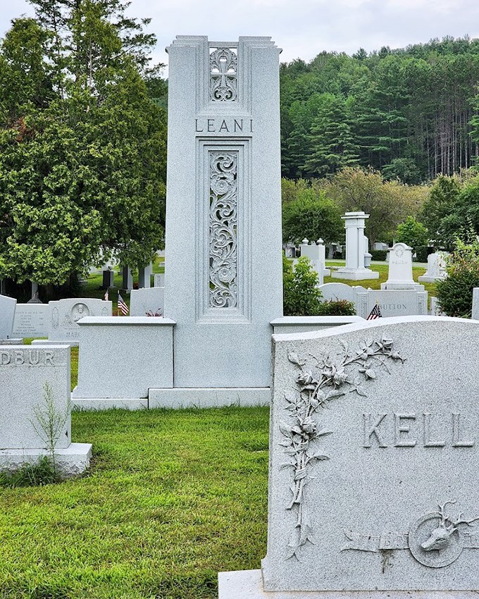 Reaching skyward like Art Deco dreams, this towering Leani monument transforms granite into architectural poetry.