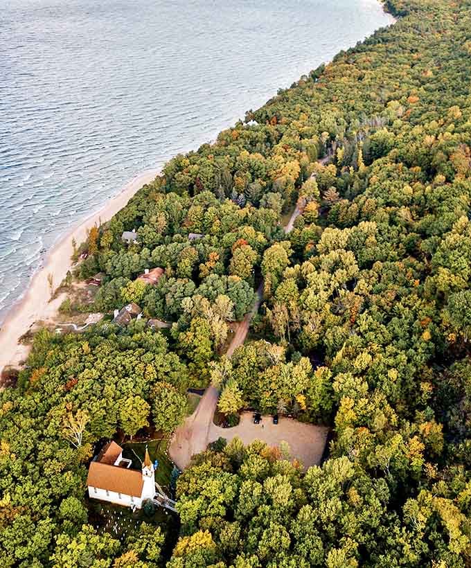 From above, the relationship between forest and lake becomes clear – a green ribbon hugging the blue expanse of Lake Michigan.