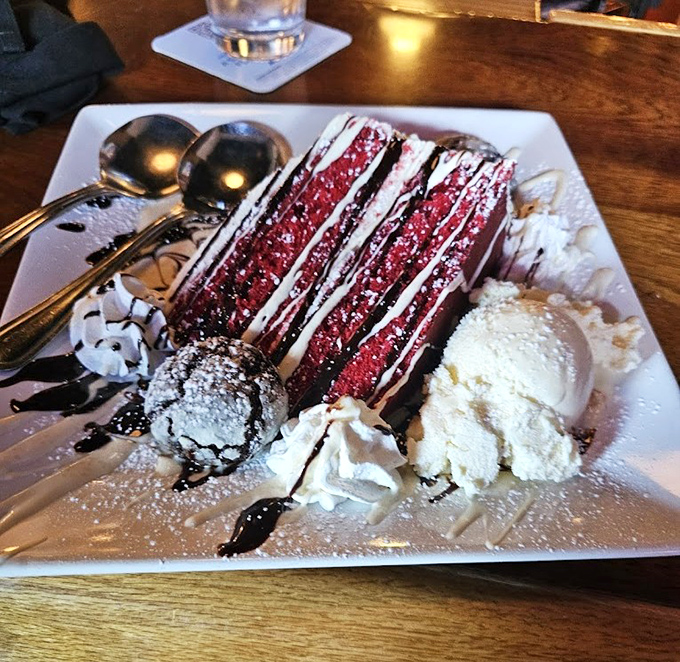 Red velvet cake that makes neighboring tables stop mid-conversation &ndash; layers of crimson decadence that demand to be photographed first.