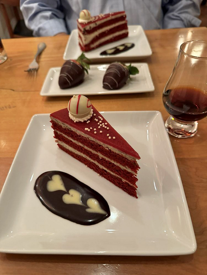 Red velvet cake elevated to art form &ndash; layers of crimson perfection with cream cheese frosting that strikes the ideal sweet-tangy balance.