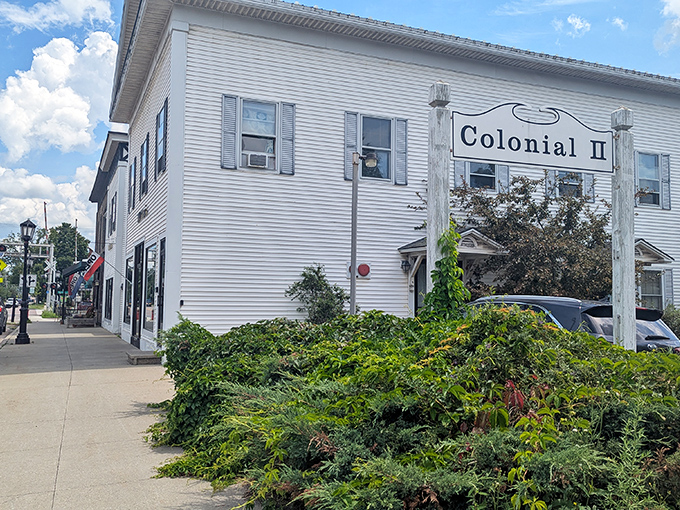 The Colonial II building houses this fabric wonderland in Essex Junction, where Vermont charm meets quilting passion behind these classic white clapboards.