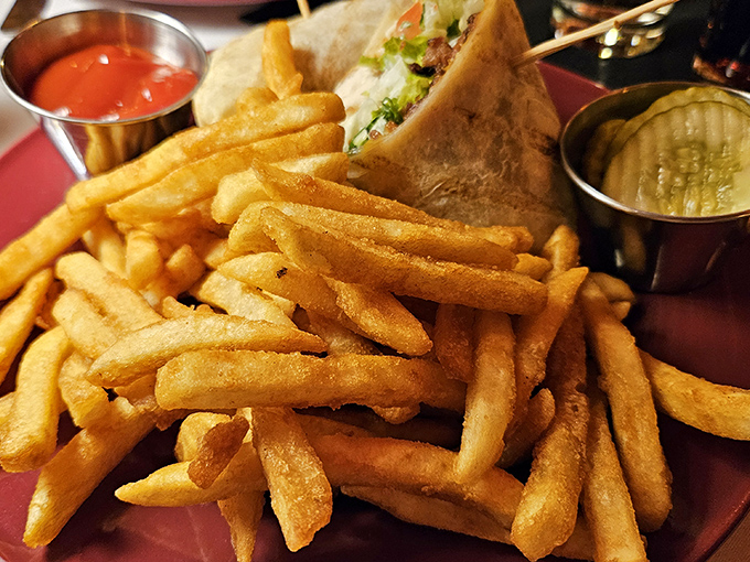 Golden, crispy french fries piled high &ndash; the kind that stay crunchy on the outside while maintaining that perfect potato fluff within. Simple perfection.