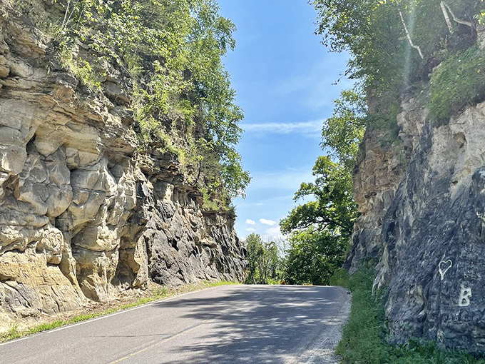 Sunlight plays across the hand-hewn rock face, highlighting chisel marks that have weathered a century of Wisconsin seasons.