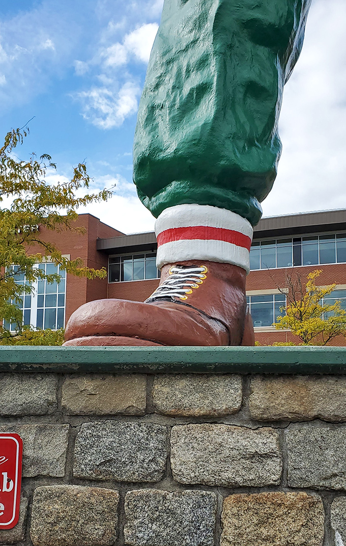 Close-up of those work boots—size "enormous" with authentic laces and the kind of craftsmanship that supports a man who dug the Great Lakes.