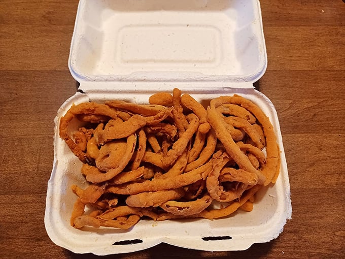 Onion rings that don't know the meaning of moderation. These golden hoops of happiness aren't just a side dish&mdash;they're a commitment.