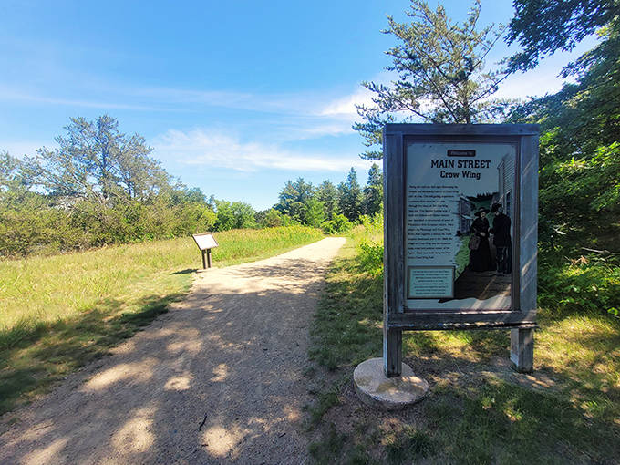 A wooden sign points toward "Sioux Camp" &ndash; history's version of GPS, only with more character and fewer software updates.