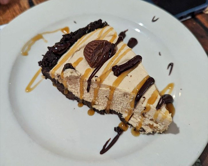 Peanut butter pie that's worth every calorie &ndash; chocolate crust cradling velvety filling with sauces playing a delicious game of connect-the-dots.