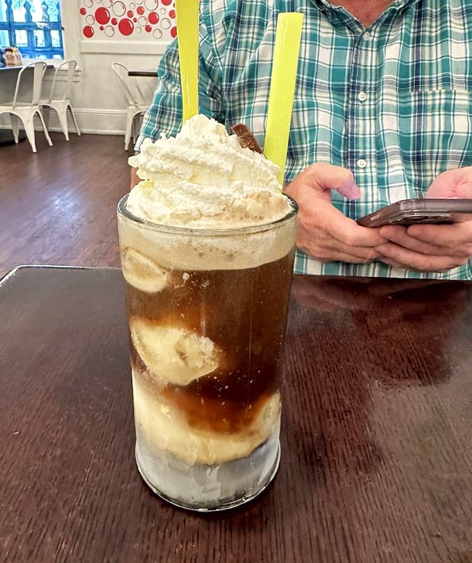 This isn't just a milkshake &ndash; it's a commitment, a dessert skyscraper requiring both strategy and napkins to conquer.