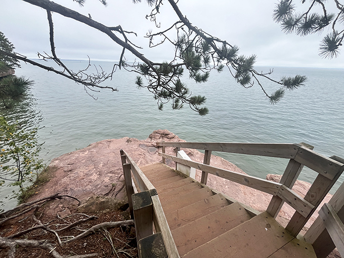 Wooden steps descend to Lake Superior's edge, where the boundary between earth and water has been negotiated for eons.