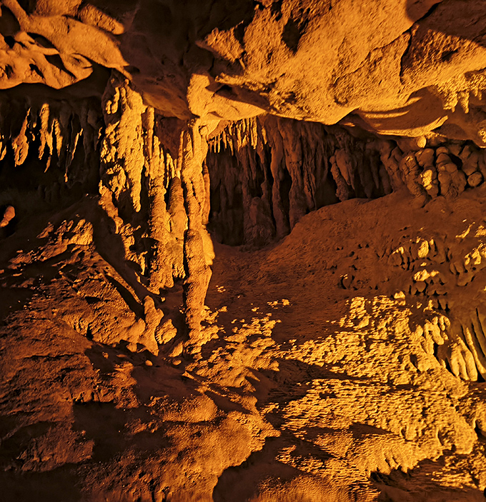 Wow! Look at those formations! The warm lighting makes these ancient stalactites and flowstones absolutely glow like fiery copper.