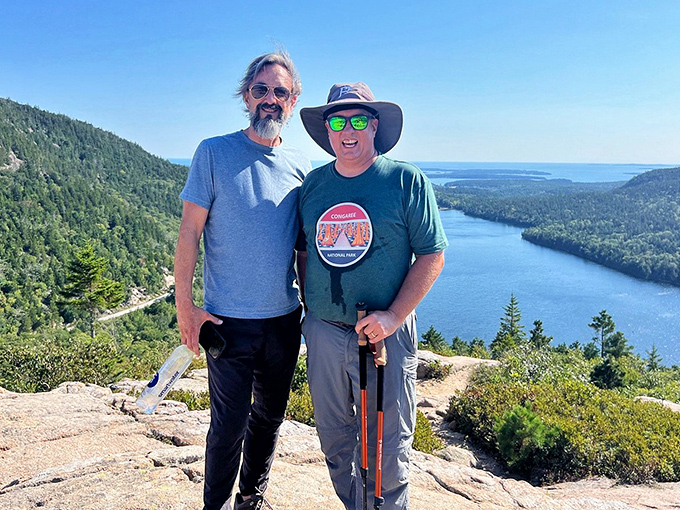 Fellow adventurers share in the wonder of Bubble Rock, creating that special camaraderie that only comes from huffing up a mountain together.