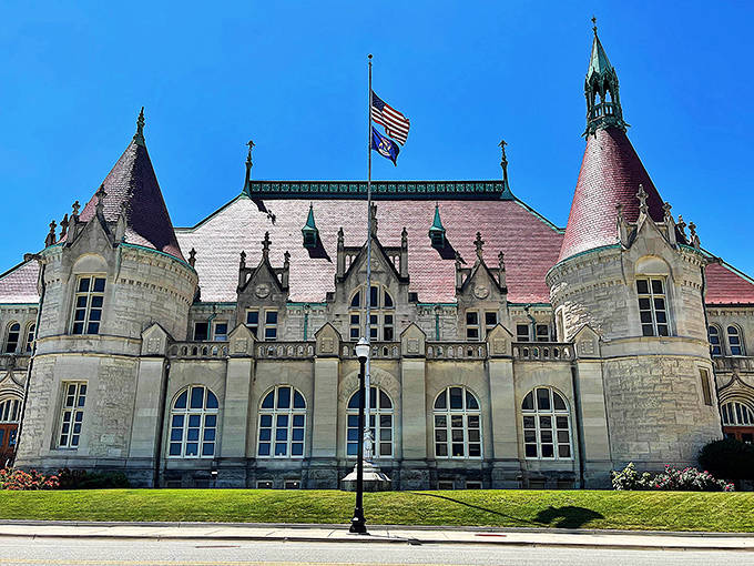 The Castle Museum's red and white stonework creates a striking pattern that stands out against Saginaw's urban landscape.