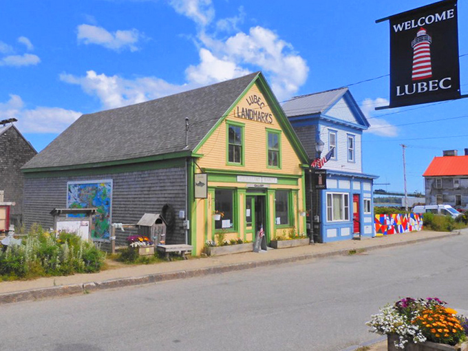 Lubec's colorful buildings welcome visitors to America's easternmost town, where the bright yellow Landmarks shop stands out against the coastal landscape.