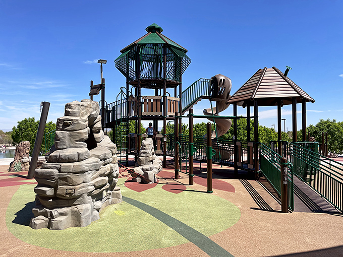 Mansel Carter Oasis Park's elaborate play structure looks like a castle for modern-day explorers. Those climbing towers promise adventure!