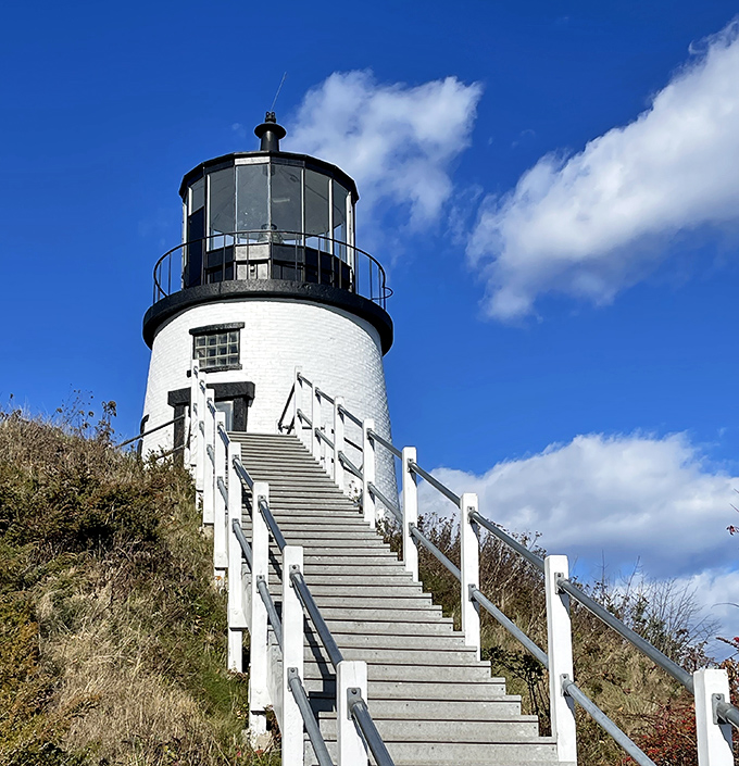 Owl's Head Light may be compact, but the climb up its steep staircase rewards visitors with breathtaking panoramic views of Penobscot Bay.