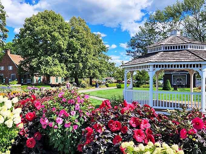 Holland's Windmill Island Gardens burst with colorful blooms surrounding the authentic Dutch windmill, a slice of Netherlands in Michigan.