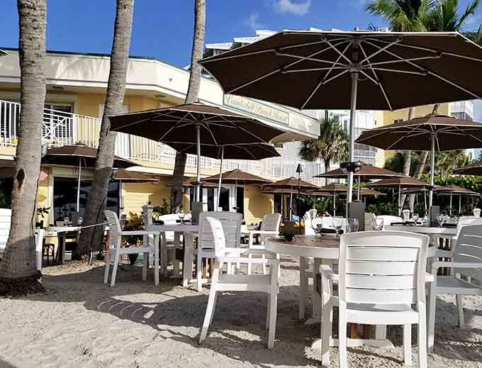 White furniture on white sand with turquoise water beyond creates a color palette that screams "Florida paradise."