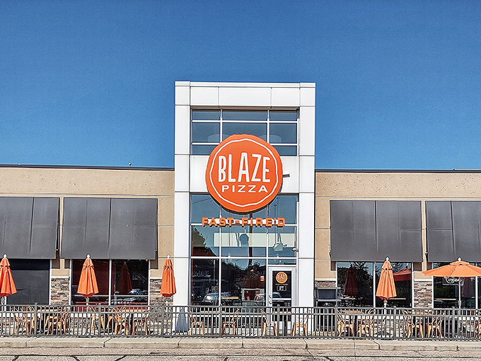 Blaze Pizza's bright orange logo pops against its contemporary fa&ccedil;ade, signaling a new approach to pizza that doesn't sacrifice quality for convenience.