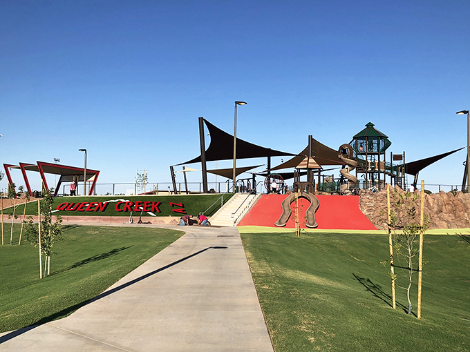 The park's grand entrance and landscaping set the stage for an extraordinary play experience. Even the walkway looks exciting!