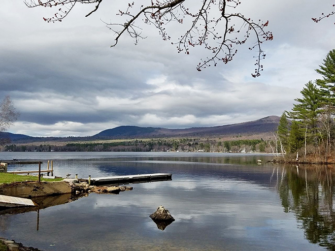 The pristine waters of Roxbury reflect the surrounding mountains, creating a double image of Maine's natural splendor.