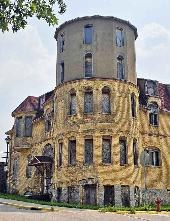 Architectural details survive decades of abandonment, the former Tanner Hospital's elegant design hinting at healthcare's more ornate past.