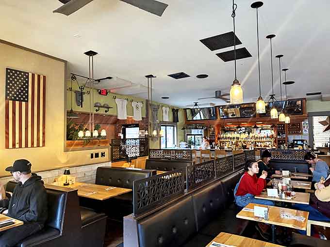 The patriotic decor and farmhouse touches create a welcoming space where locally sourced comfort food takes center stage daily.