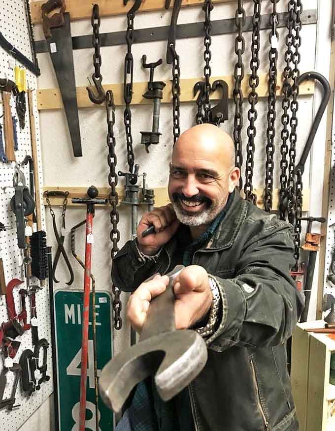 Industrial tools hang like prehistoric artifacts, telling stories of craftsmanship from an era when things were built to last generations.