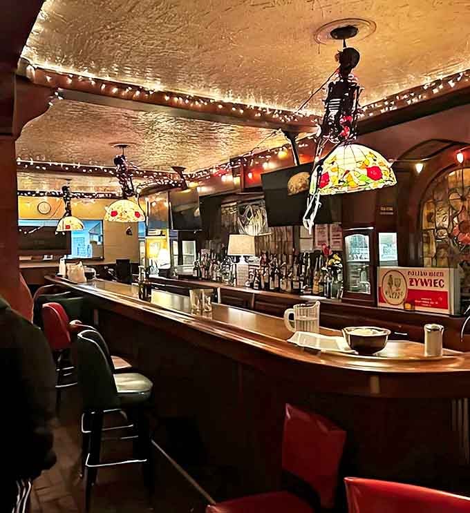 The bar's warm wood and Tiffany-style lamps create the kind of place where strangers become friends over cold Polish beer.