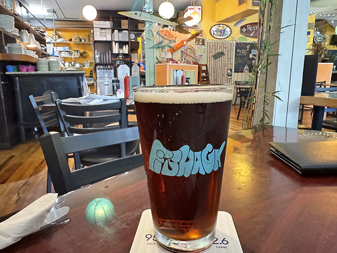 A frosty pint of amber goodness in a custom Fishack glass &ndash; because nothing complements fresh seafood quite like a cold, locally-brewed beer.