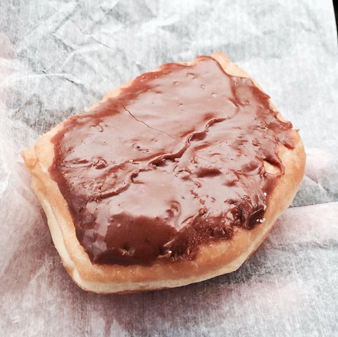 A chocolate-glazed donut so perfect it deserves its own Instagram account and fan club.
