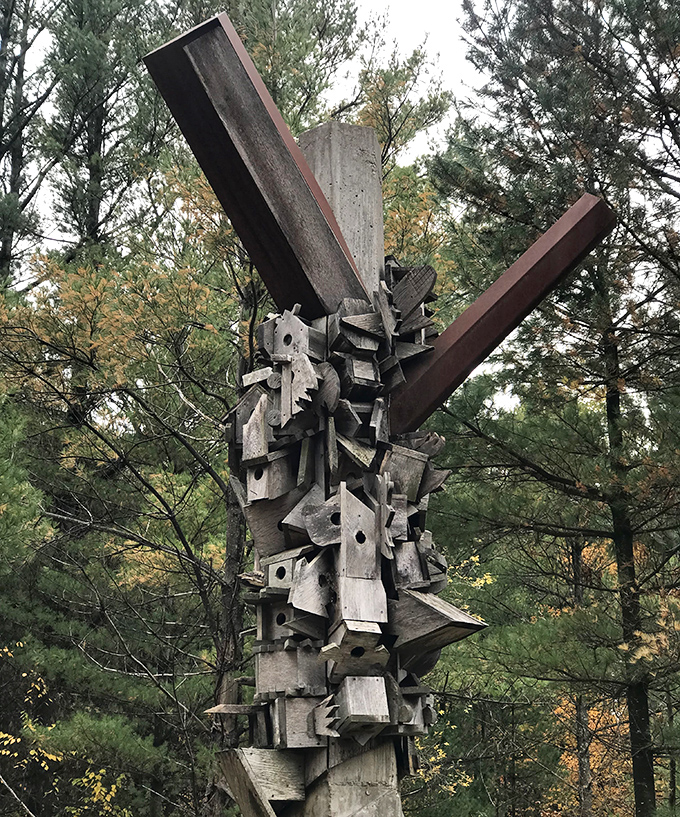 Geometric precision meets organic curves in this suspended metal creation, catching sunlight like a scientific instrument from another dimension.