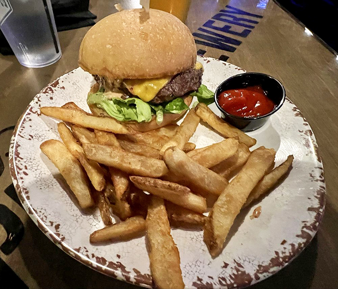 This isn't your average pub grub &ndash; a perfectly stacked cheddar burger sits alongside golden fries, demanding to be paired with a craft brew.