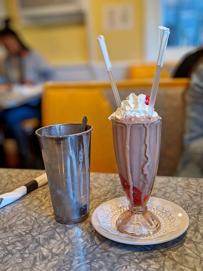 This chocolate strawberry milkshake comes with the mixing cup on the side because Henry's knows you're going to want every last drop of that creamy goodness.