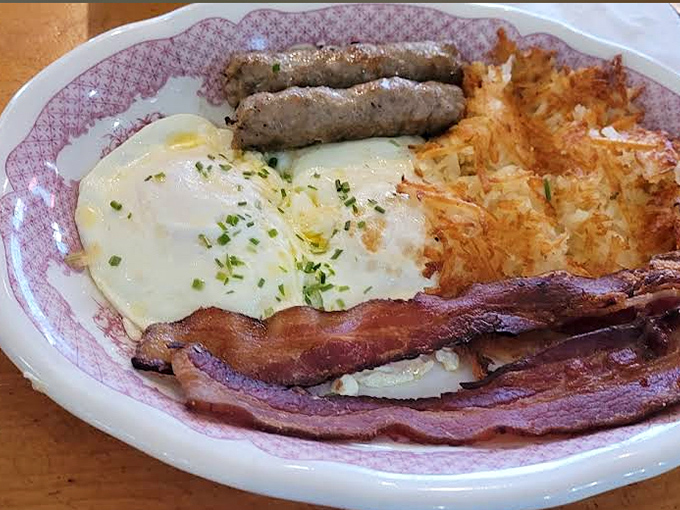 The classic breakfast plate &ndash; where eggs, bacon, sausage and hash browns gather for a morning symphony of savory satisfaction.