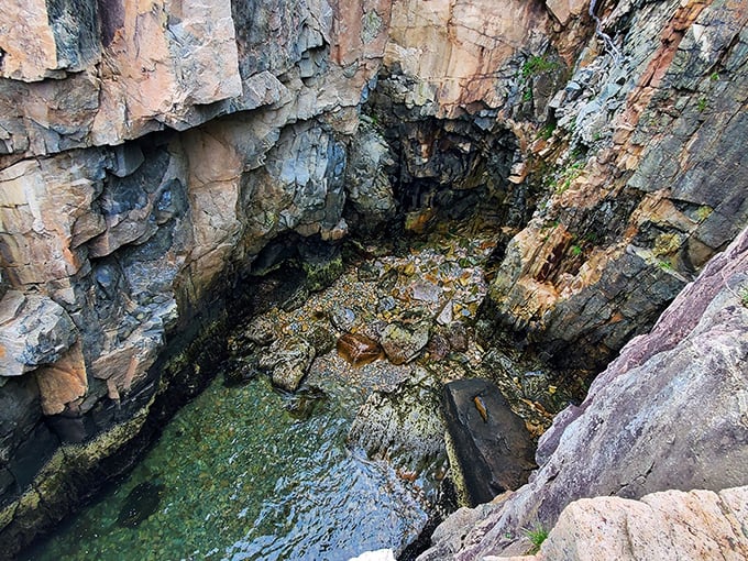 Nature's alchemy at work &ndash; sunlight transforms ordinary seawater into liquid emerald as it fills this secluded coastal inlet.