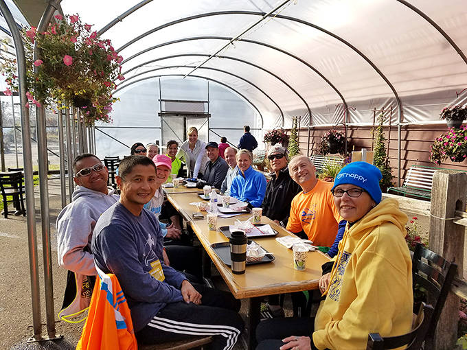 The covered outdoor seating area brings people together over shared pleasures &ndash; fresh air, good food, and the unspoken agreement that calories don't count at orchards.