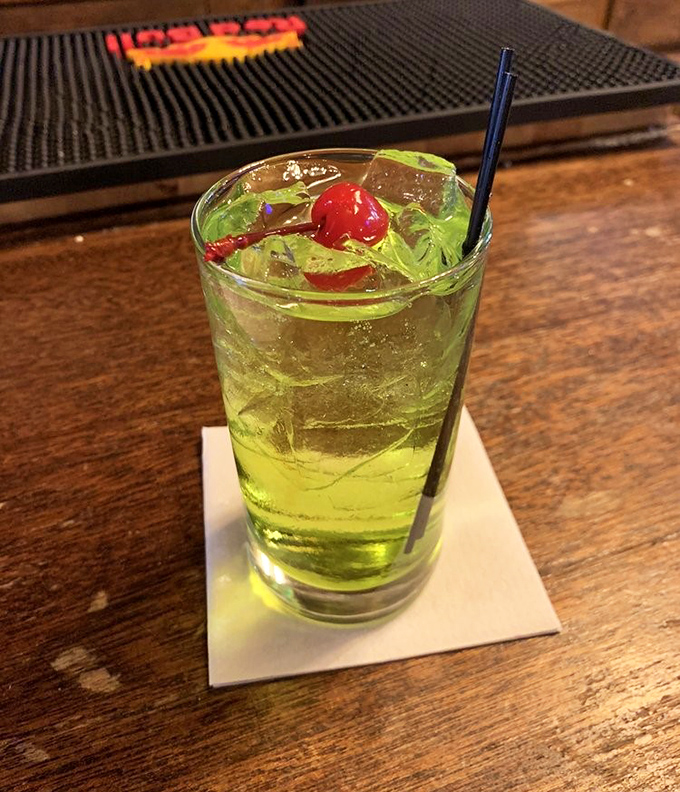 Electric green apple martini with cherry garnish &ndash; proof that this historic German establishment isn't afraid to have a little colorful fun.