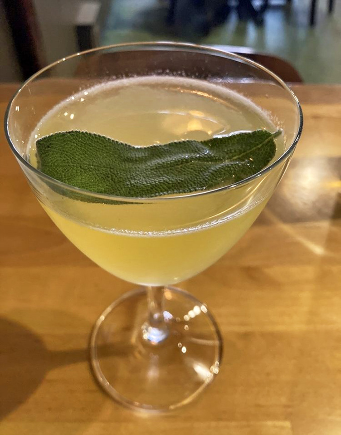 A citrus-forward cocktail crowned with fresh sage invites slow sipping &ndash; this isn't just a drink, it's liquid artistry.