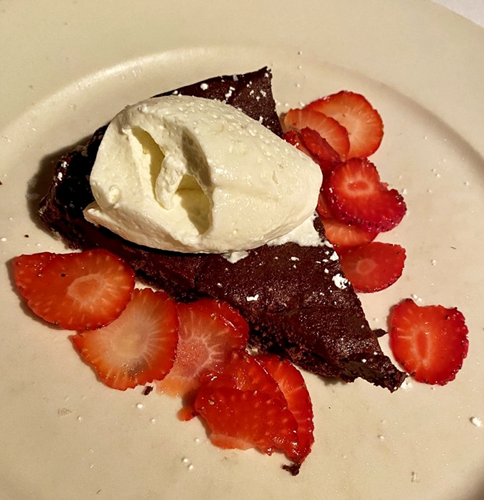 This flourless chocolate torte with fresh strawberries isn't just dessert &ndash; it's the final love note in an evening-long culinary serenade.