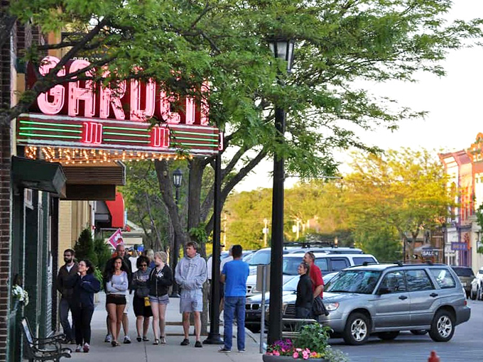 Locals and visitors gather outside the historic Garden Theater, where movie nights become community celebrations.