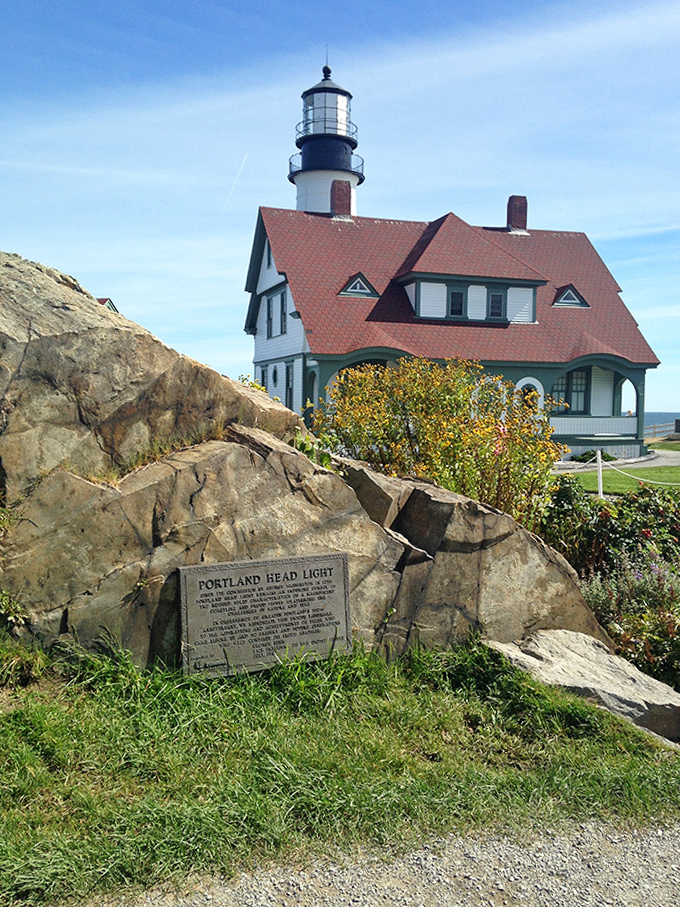 History carved in stone: The plaque tells the lighthouse's story, but the weathered rocks around it have witnessed every chapter.