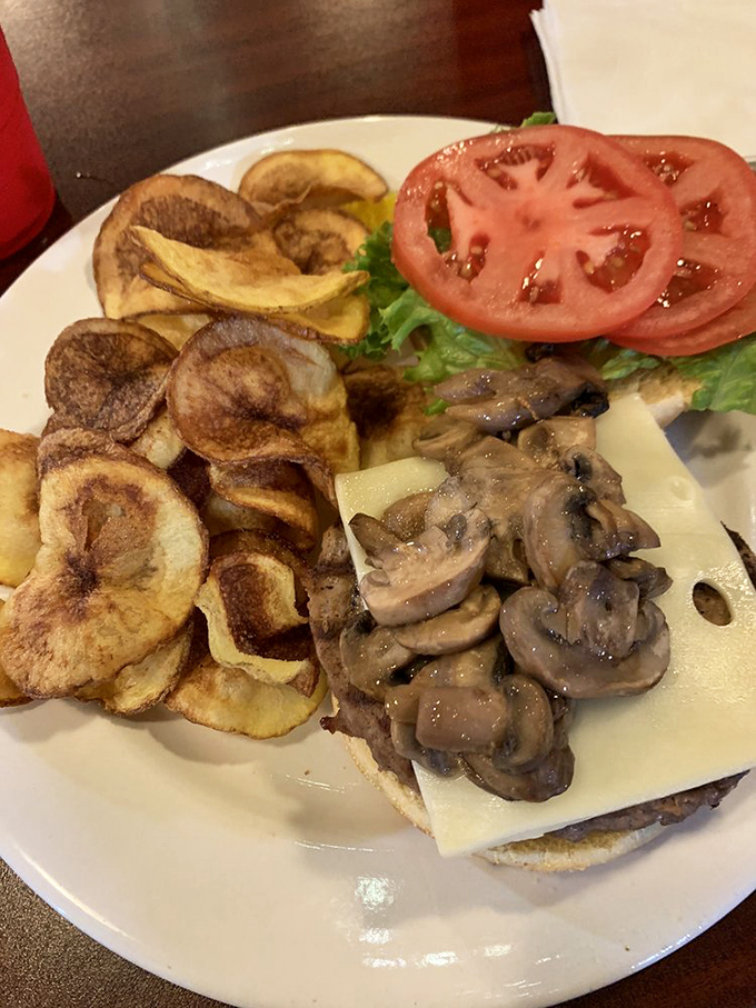 This mushroom cheeseburger with homemade potato chips delivers comfort food perfection &ndash; crispy, savory, and utterly satisfying with every bite.