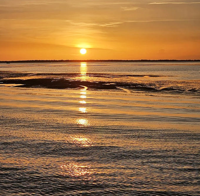 Nature's daily masterpiece unfolds across the Gulf, painting the sky and water in colors that no artist could improve upon.