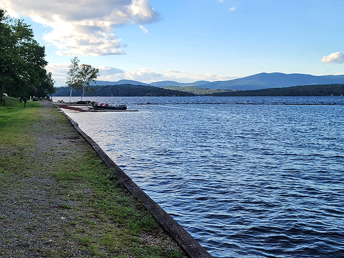 Breathtaking panorama of Rangeley Lake stretching to the horizon, where water meets mountains in perfect harmony.