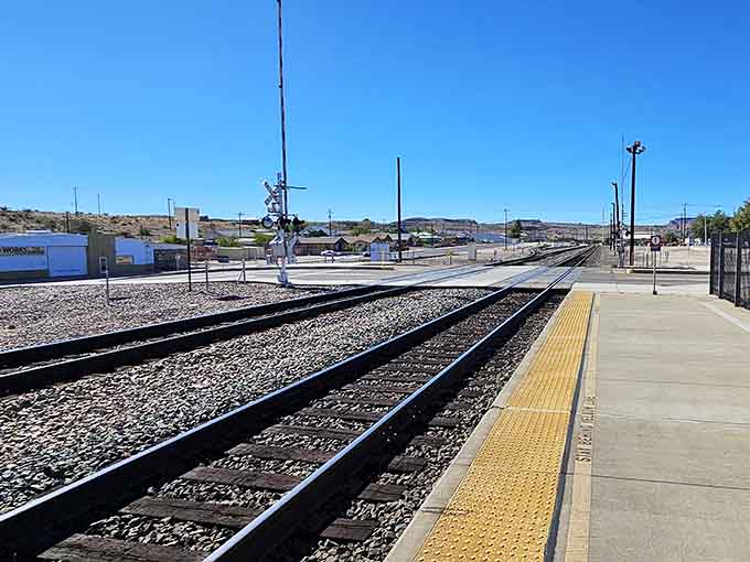 This aerial perspective reveals how the railroad and Route 66 run parallel, two American icons sharing the landscape.