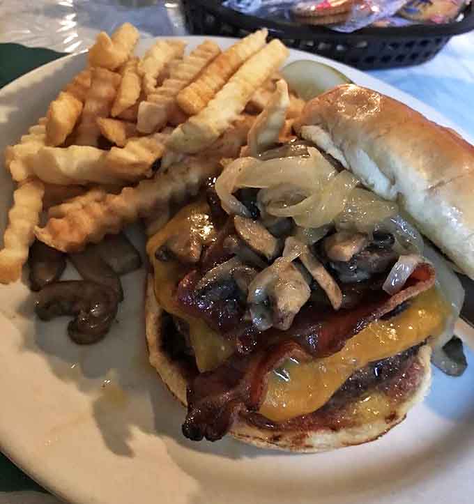 The Rochester Wonder Burger lives up to its name, piled high with toppings that require architectural planning to eat properly.