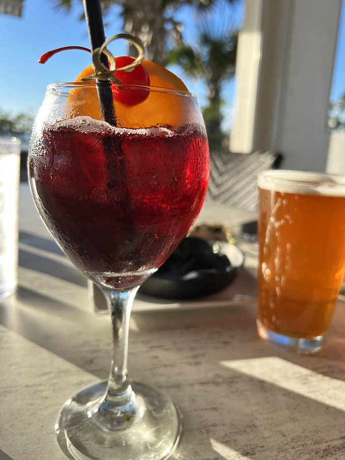 Sangria: Ruby red temptation in a glass, garnished with citrus and promising vacation vibes with every sip.